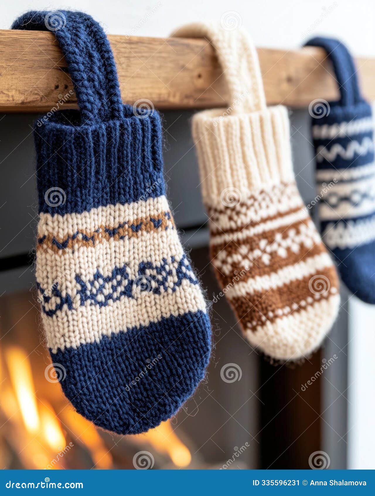 A Warm Mittens with Different Cultural Designs Hanging by the Fireplace ...