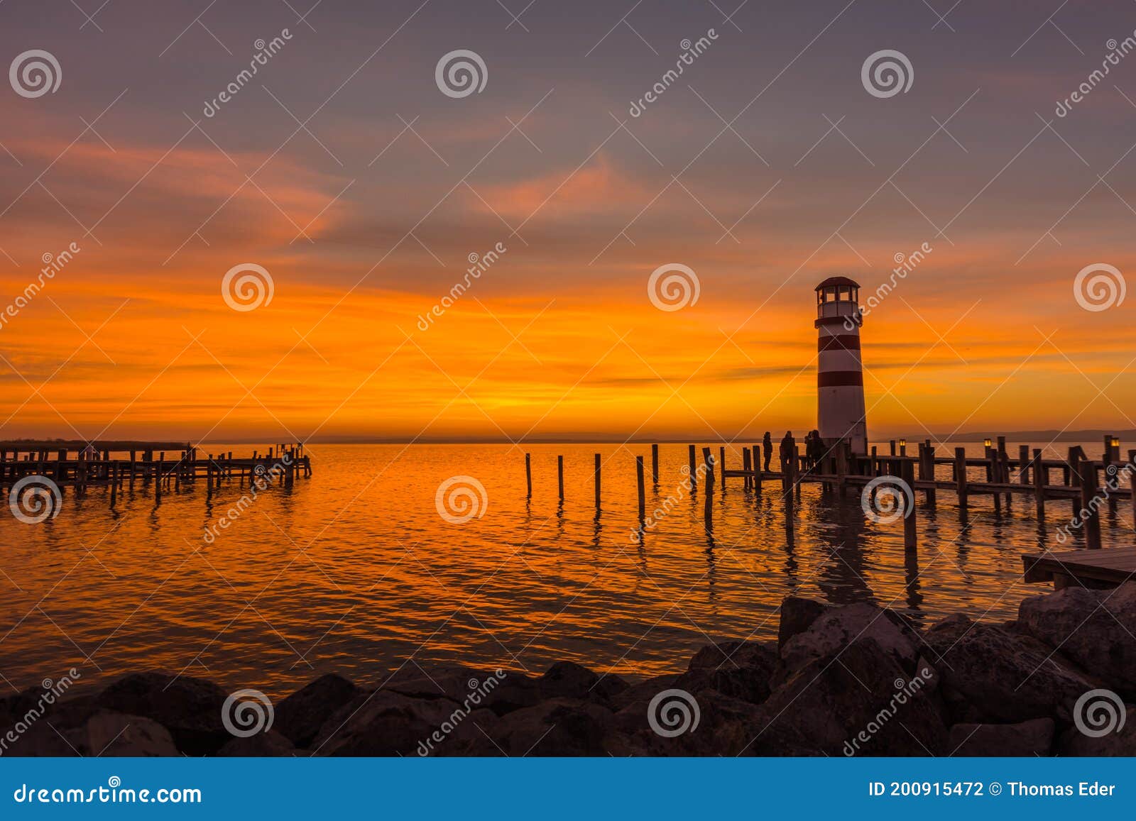 Warm Sunset at a Lake with Lighthouse Stock Photo - Image of reflection ...