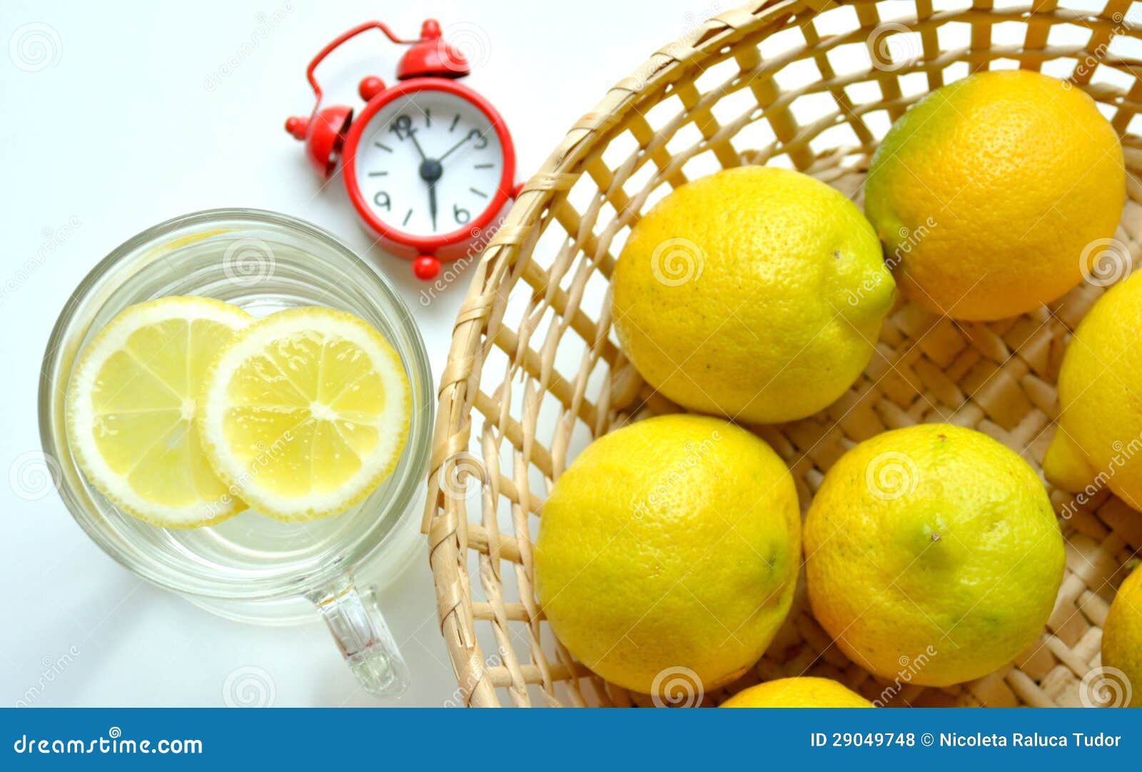 Warm Water and Lemon for Breakfast Stock Photo - Image of drink, clock ...