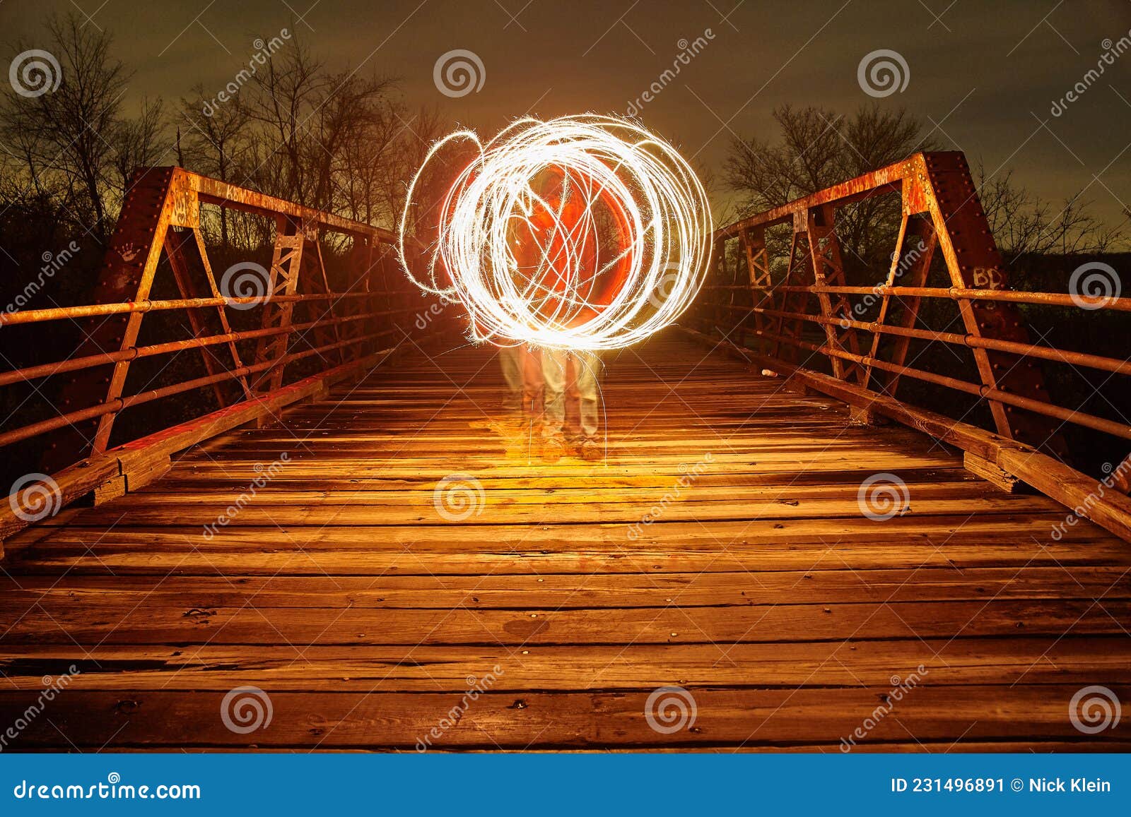 Warm White Light Illuminates a Metal Bridge at Dusk Stock Image - Image ...