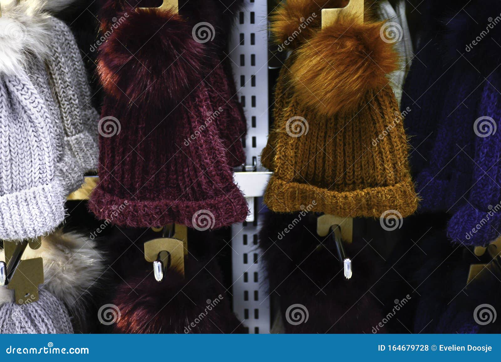 Warm Winter Beanie Hats Hanging in the Store Stock Photo - Image of ...
