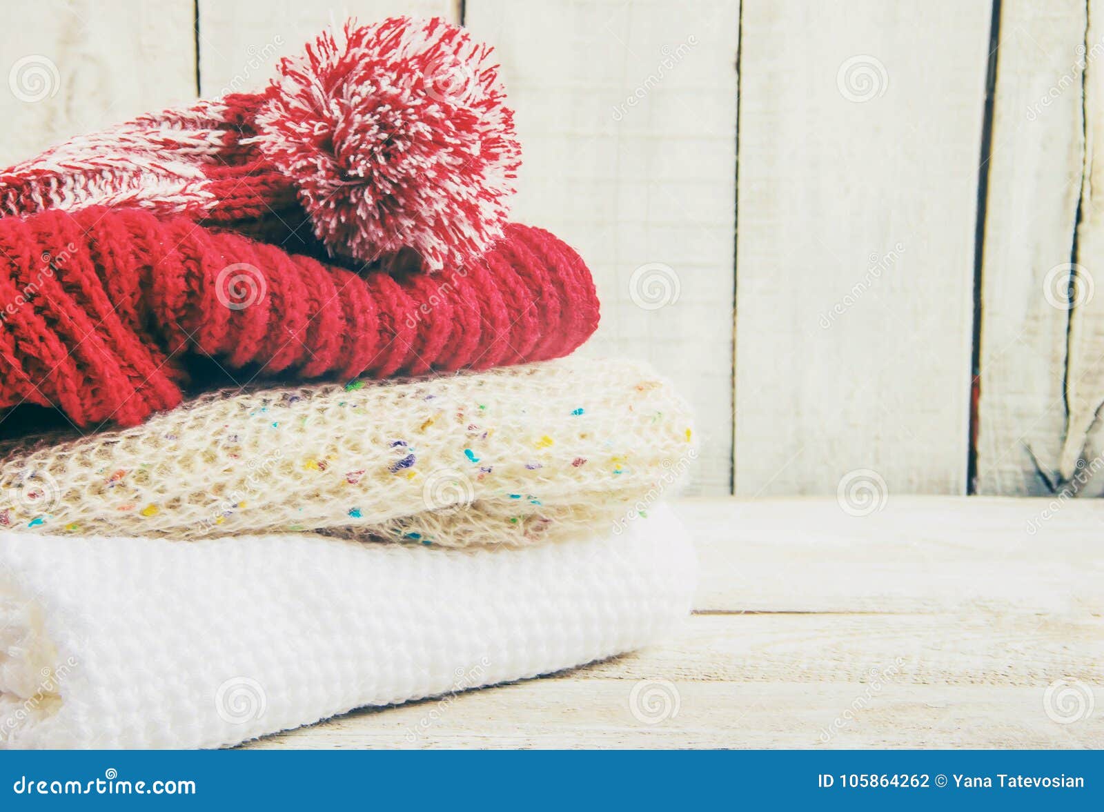 Warm Winter Clothes on a Wooden Background. Stock Photo - Image of ...