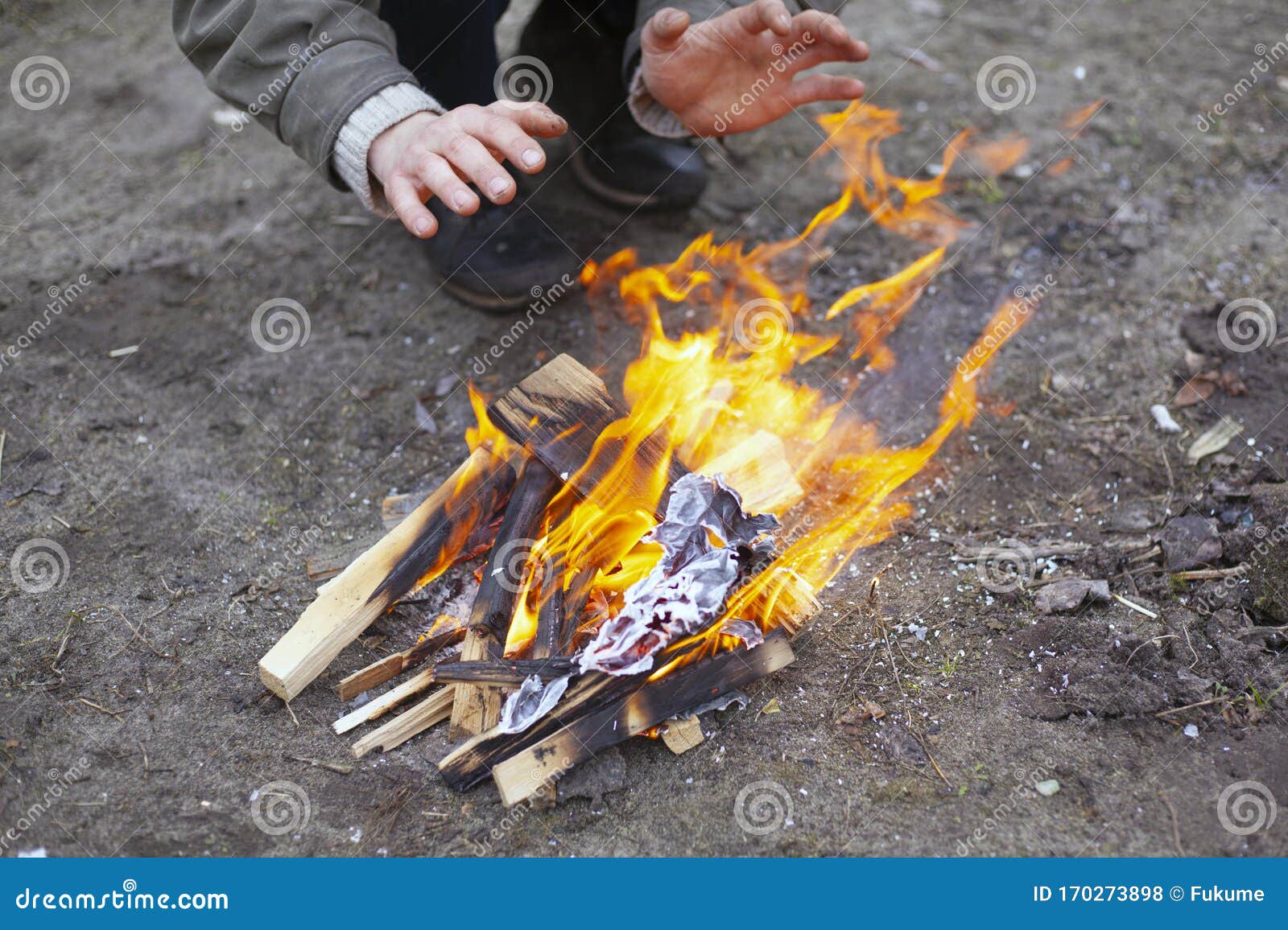 Warm Your Hands by the Fire. the Guy is Trying To Get Rid of the Cold ...