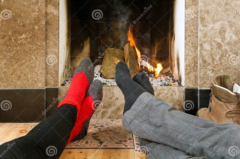 Warming by the fire stock photo. Image of bright, outstretched - 14931128