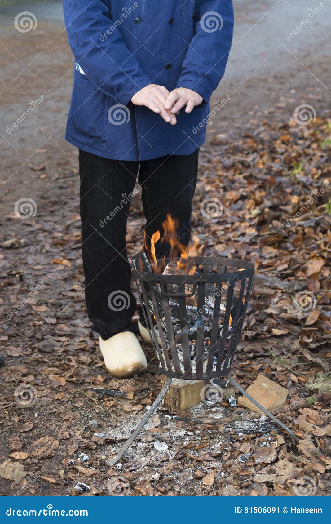 Warming hands on fire pit stock image. Image of leaves - 81506091