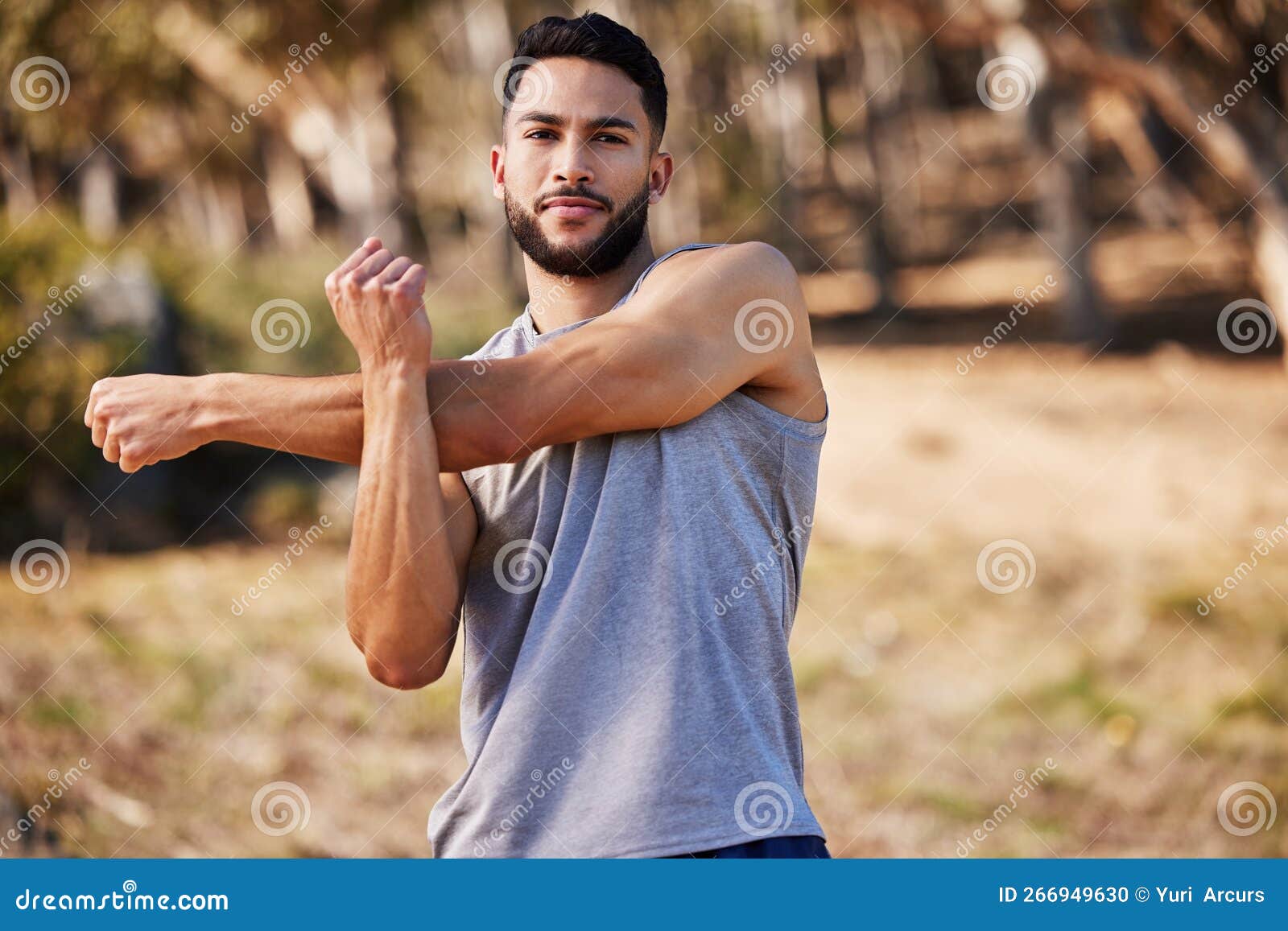Warming Up those Muscles. a Handsome Young Man Standing Alone Outside ...