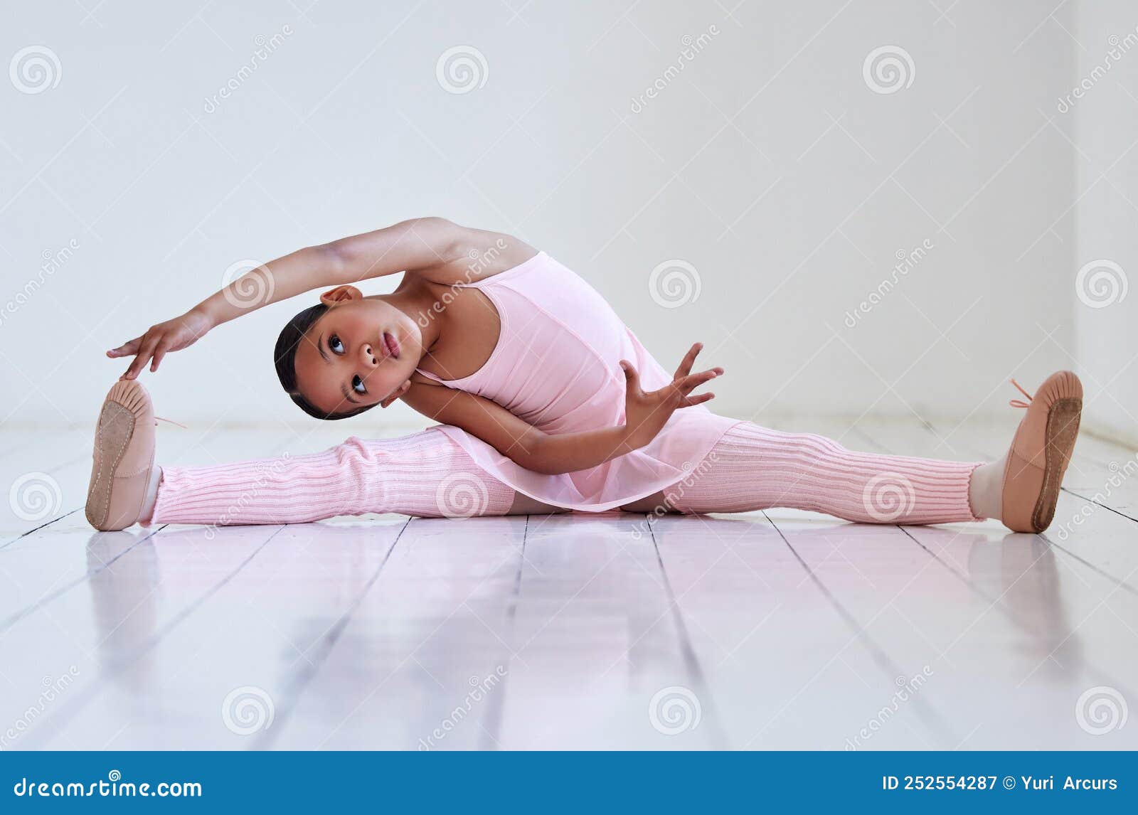 Warming Up before Practicing Her Routine. a Little Girl Doing the ...