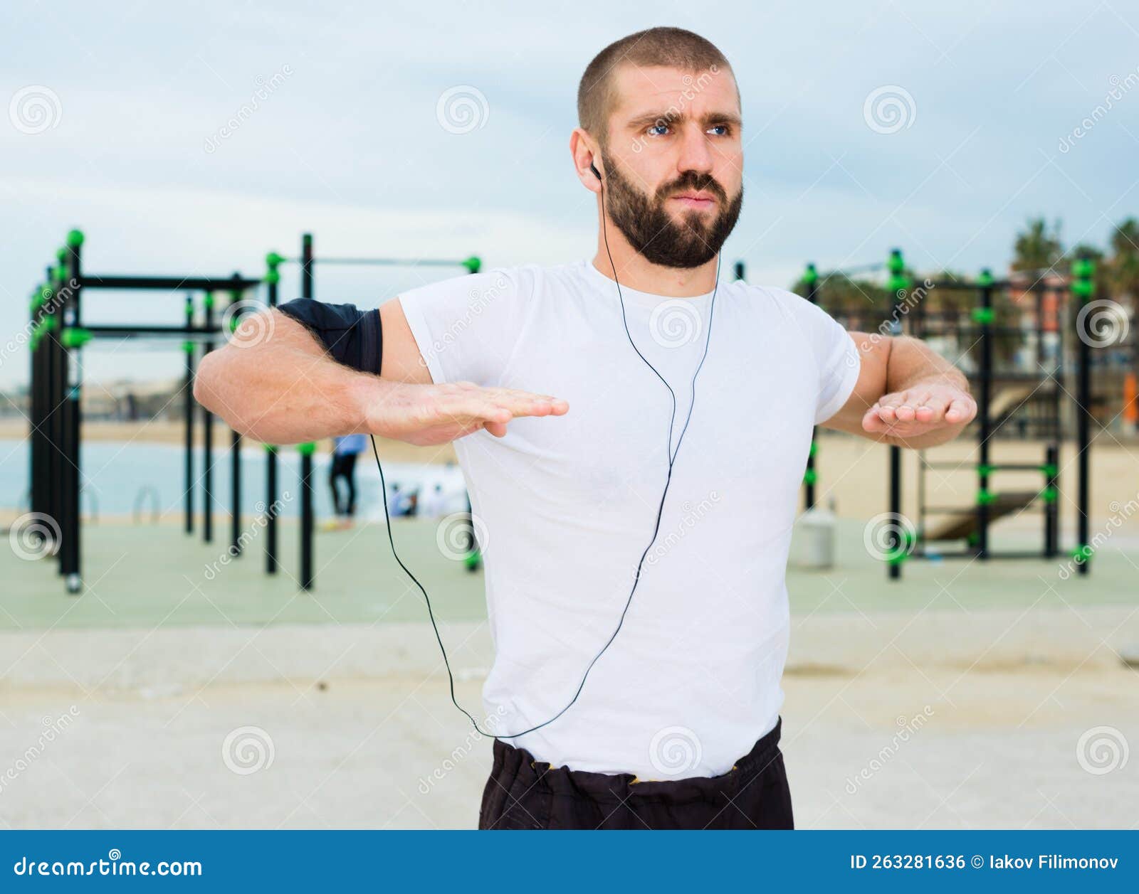 Warming up young man stock photo. Image of male, body - 263281636
