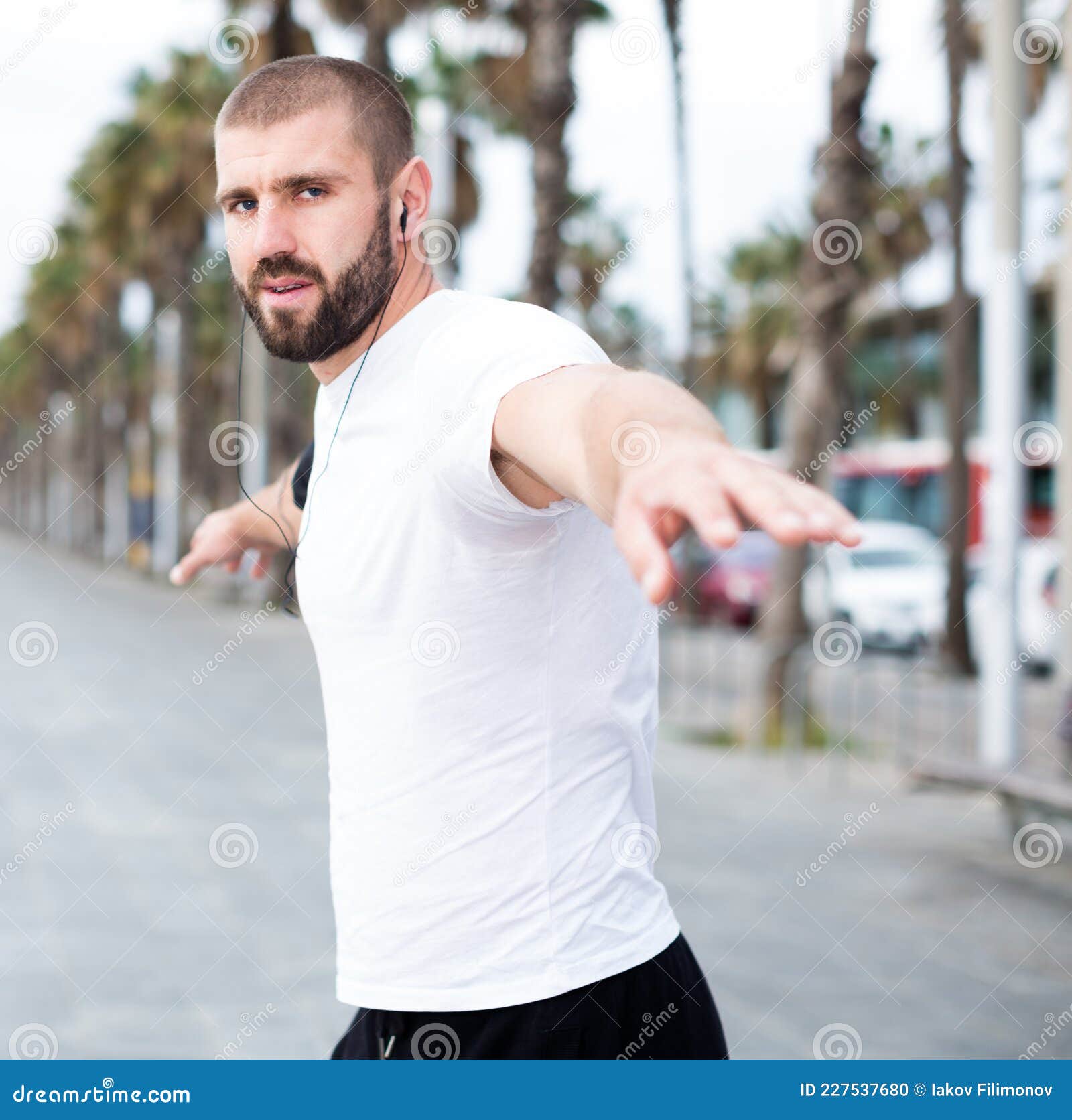 Warming up young man stock photo. Image of sportswear - 227537680