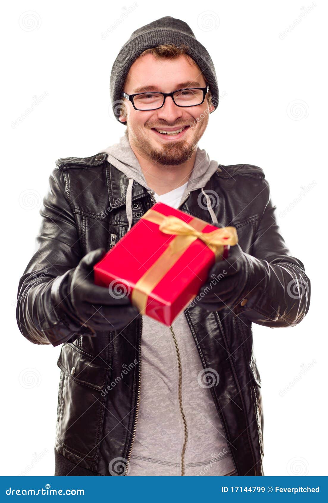 Warmly Dressed Young Man Handing Wrapped Gift Out Stock Image - Image ...