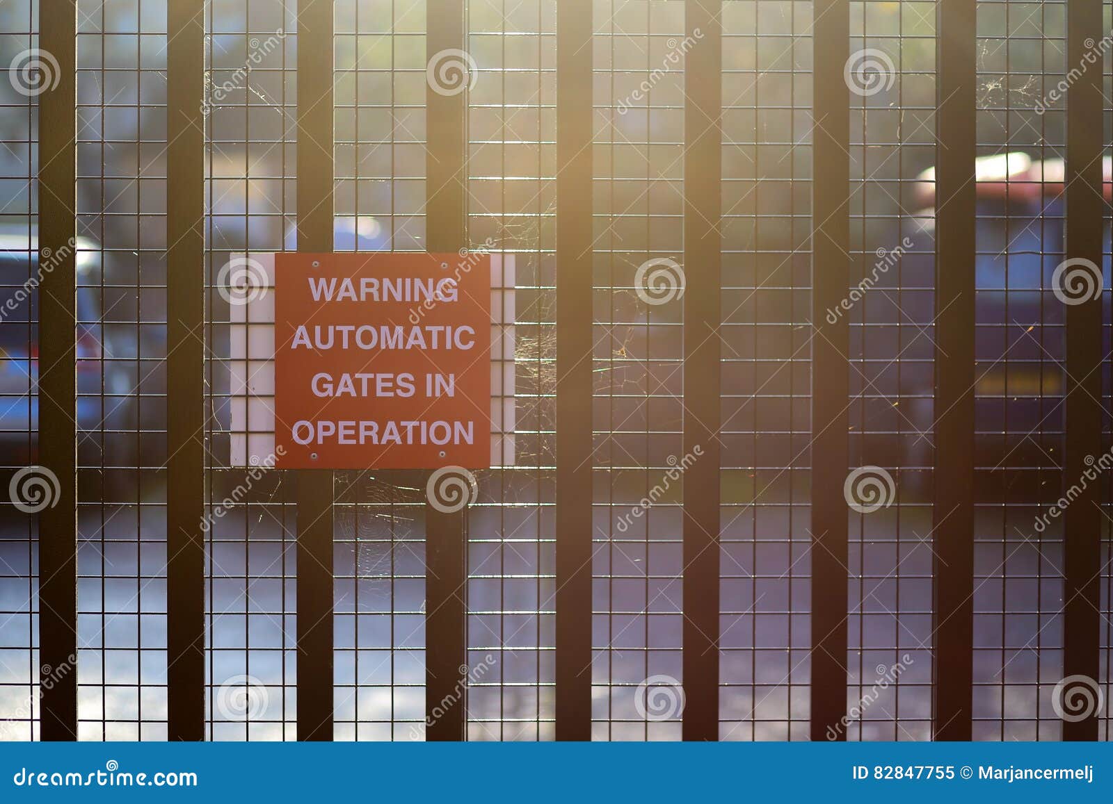 Warning Automatic Gates in Operation, Red Sign on Metal Gate Stock ...