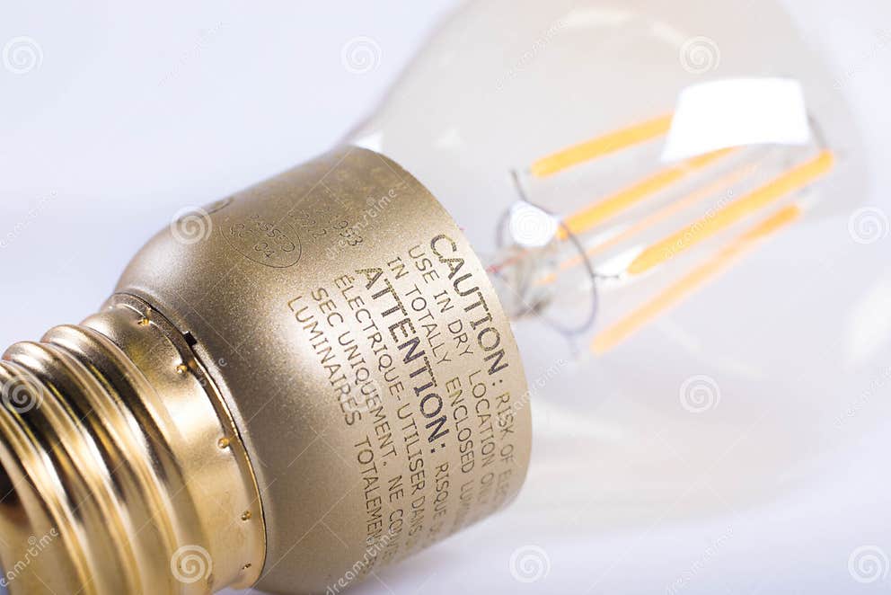 Warning or Caution Sign Printed on the Light Bulb Stock Image - Image ...