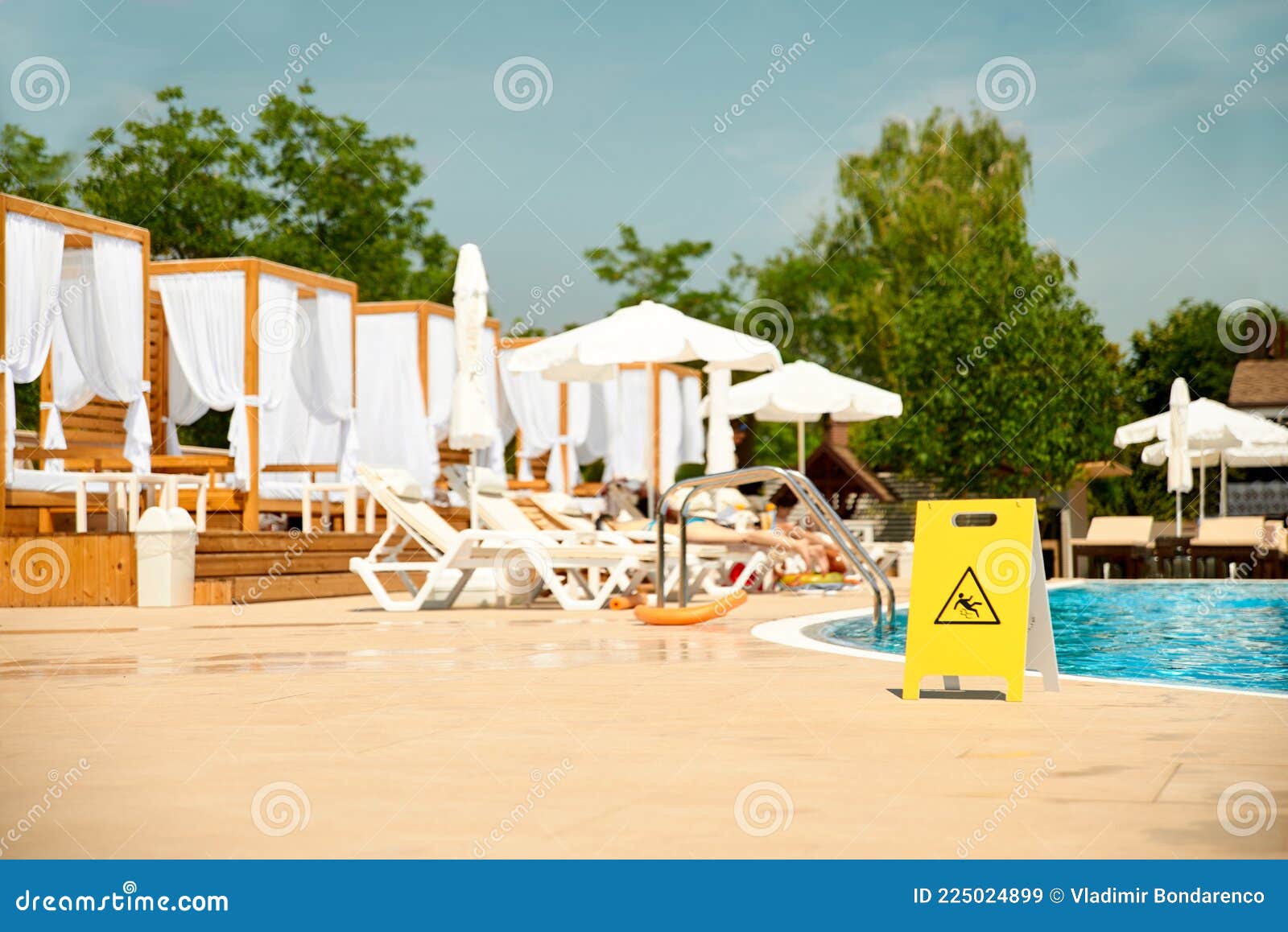 Warning Plates Wet Floor beside the Pool Made of Yellow Plastic. Stock ...