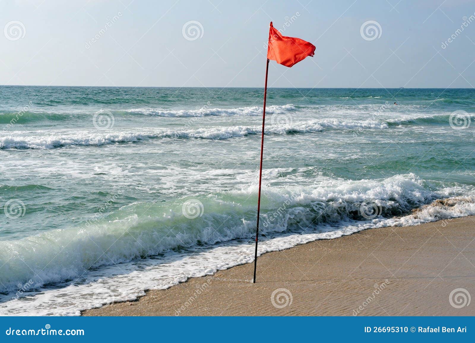 A Warning Red Flag of Danger at Sea Stock Photo - Image of cloudy ...