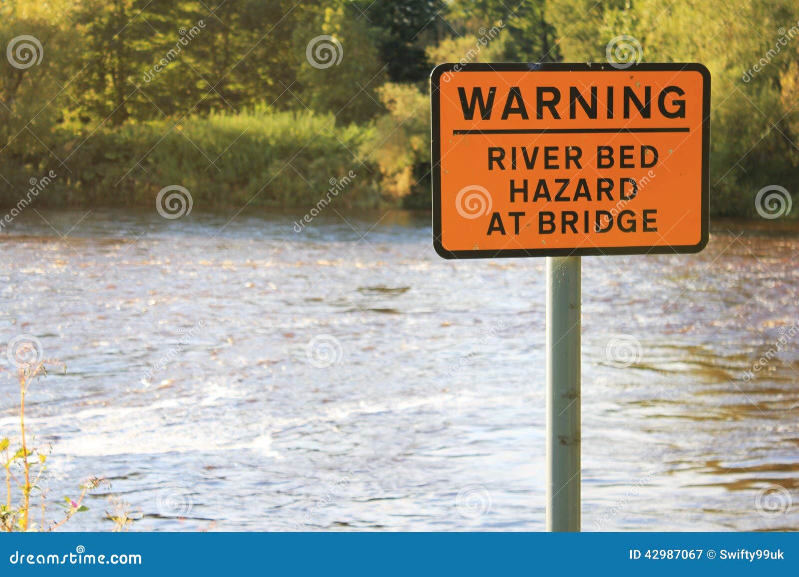 Warning River Bed Hazard at Bridge Sign Stock Image - Image of weather ...