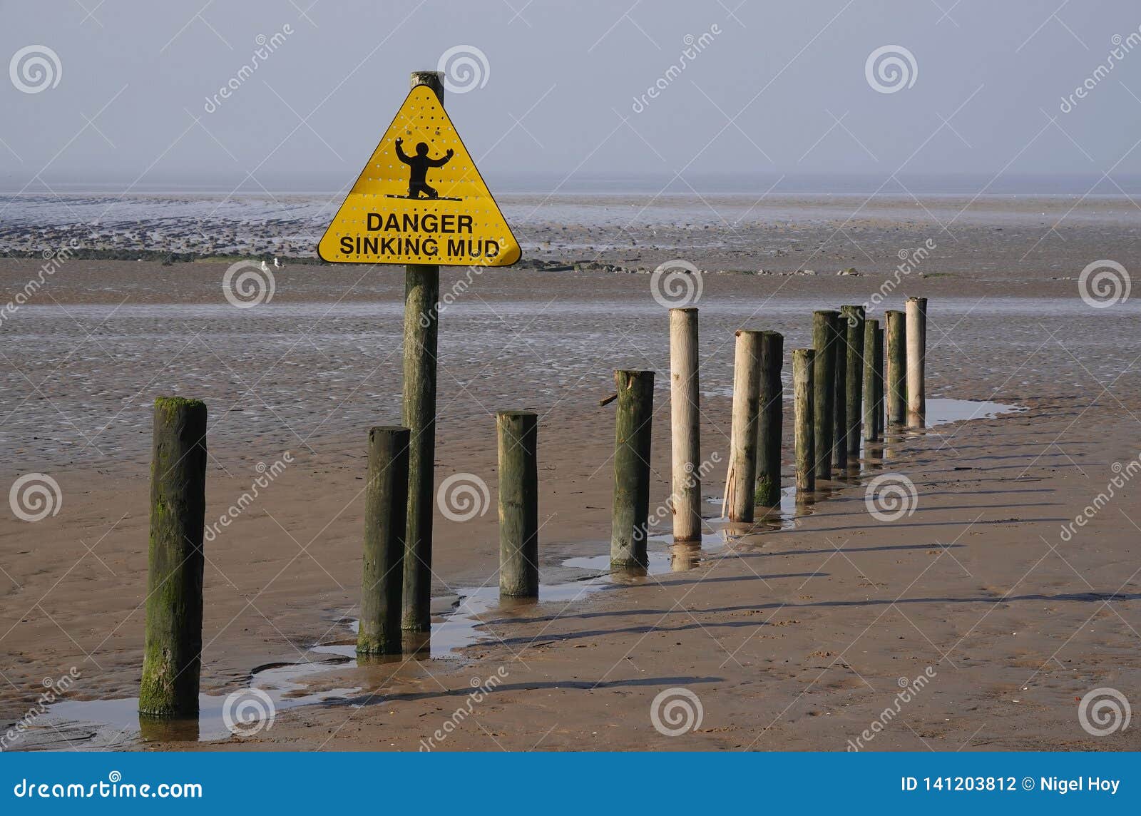 Warning Sign on Dangerous Mud Stock Photo - Image of yellow, uphill ...