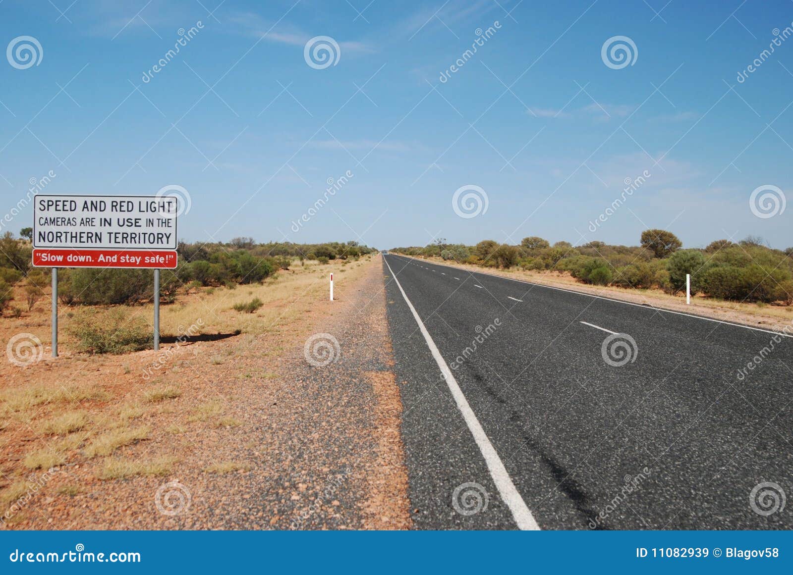 Warning Sign on a Desert Road Stock Image - Image of trees, exploration ...
