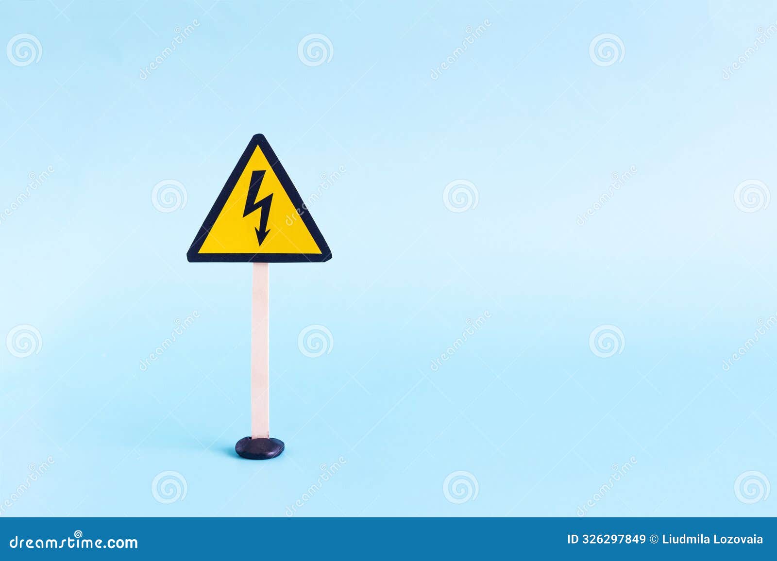 Warning Sign Electrical Danger in a Yellow Triangle on a Light ...