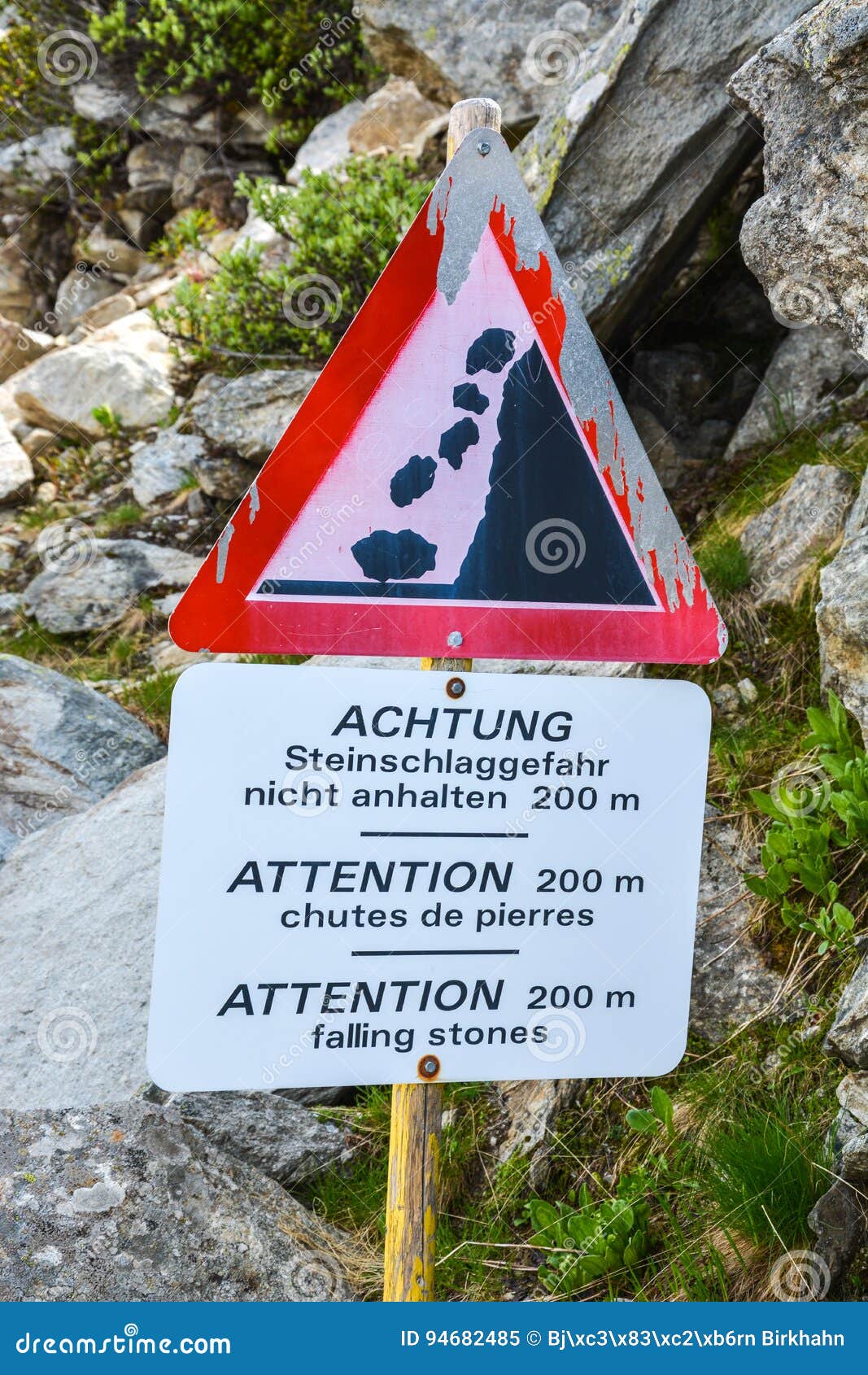 A Warning Sign about Falling Stones in the Mountains Stock Image ...