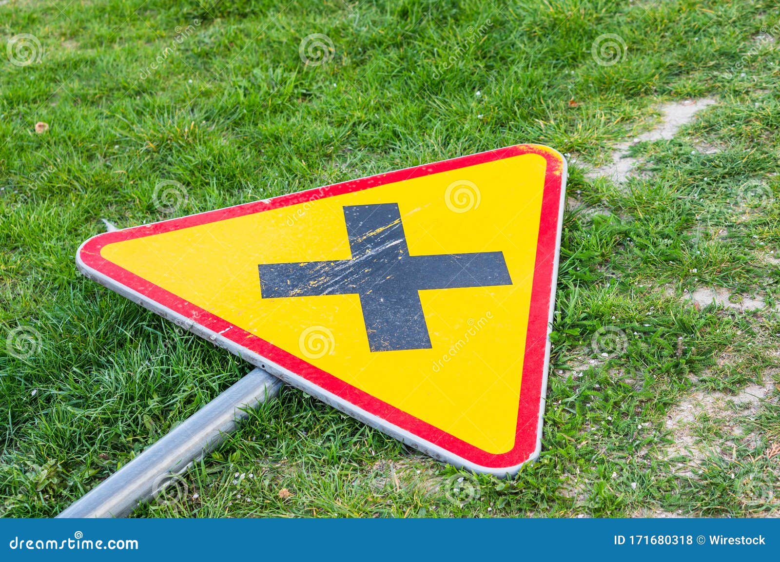 Warning Sign on a Grassy Ground Stock Photo - Image of line, black ...