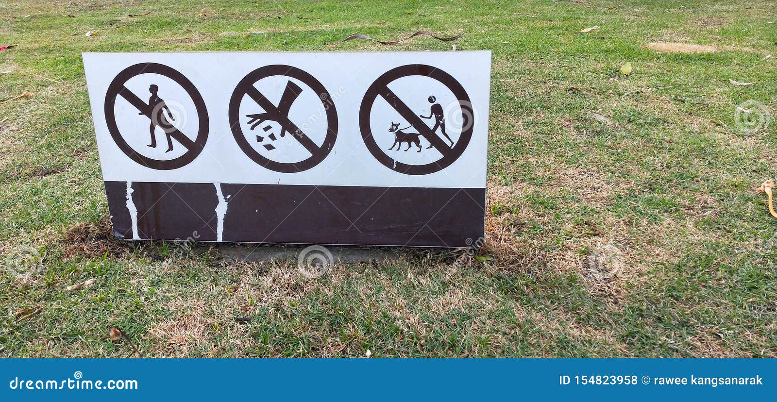 A Warning Sign on Green Grass Field in Parks Stock Photo - Image of ...
