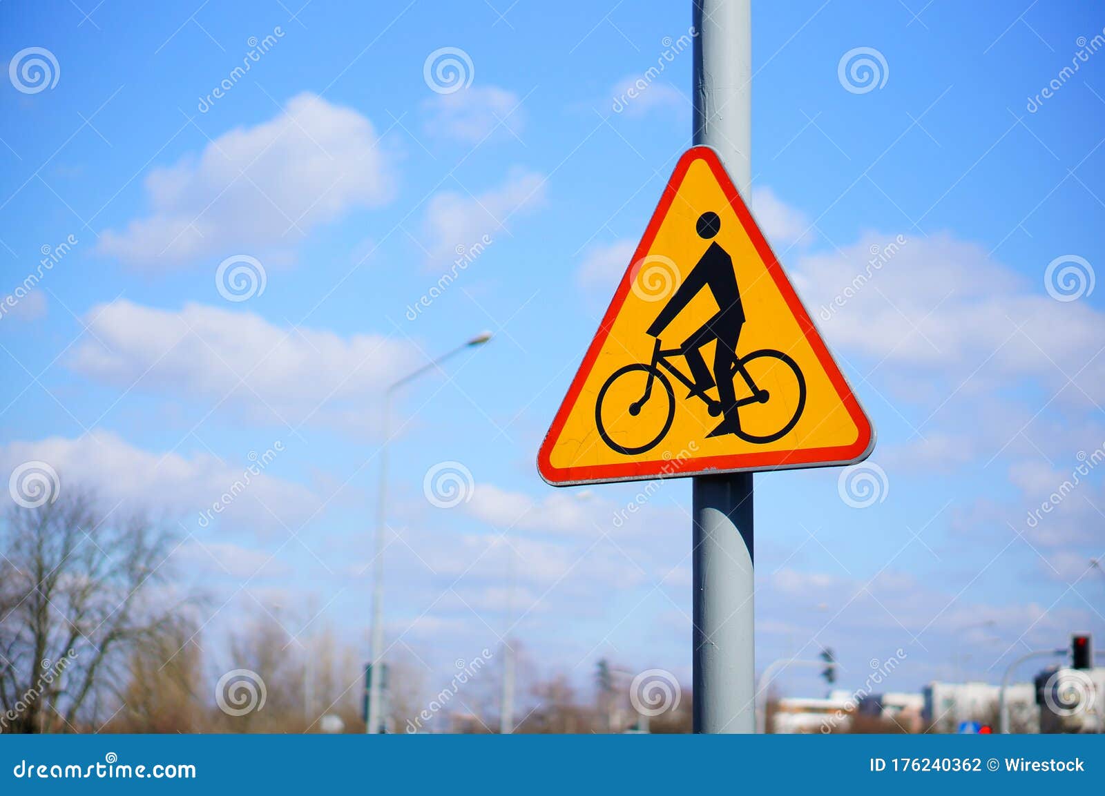 Warning Sign on a Pole with a Blurred Background Stock Photo - Image of ...