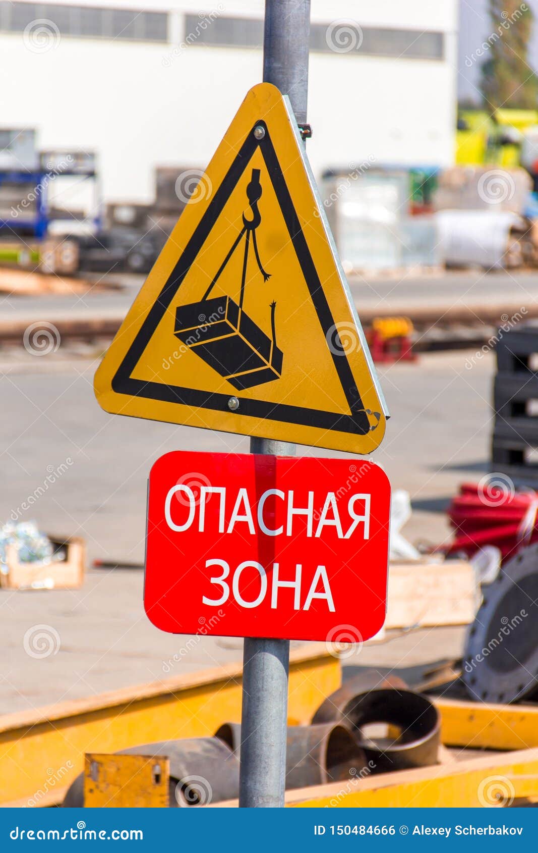 Warning Sign Of A Possible Drop In Cargo From A Crane On A Yellow ...