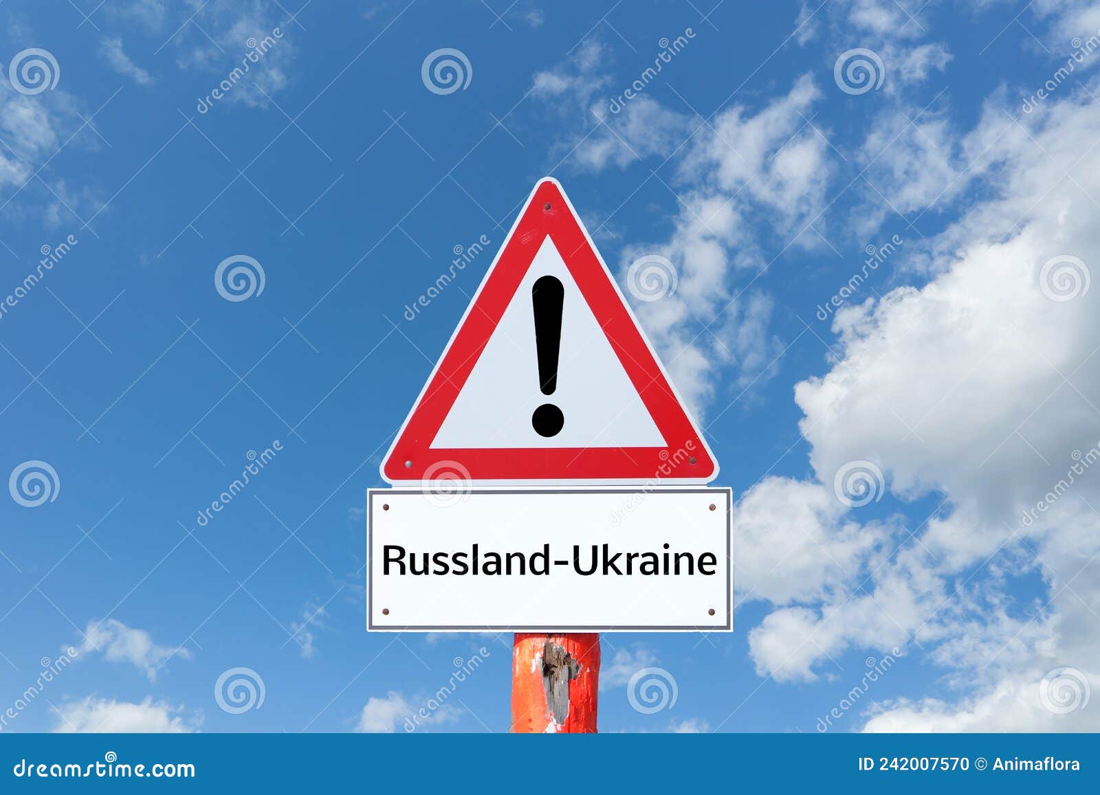 Warning Sign Russia Ukraine on Blue Background in German Stock Photo ...