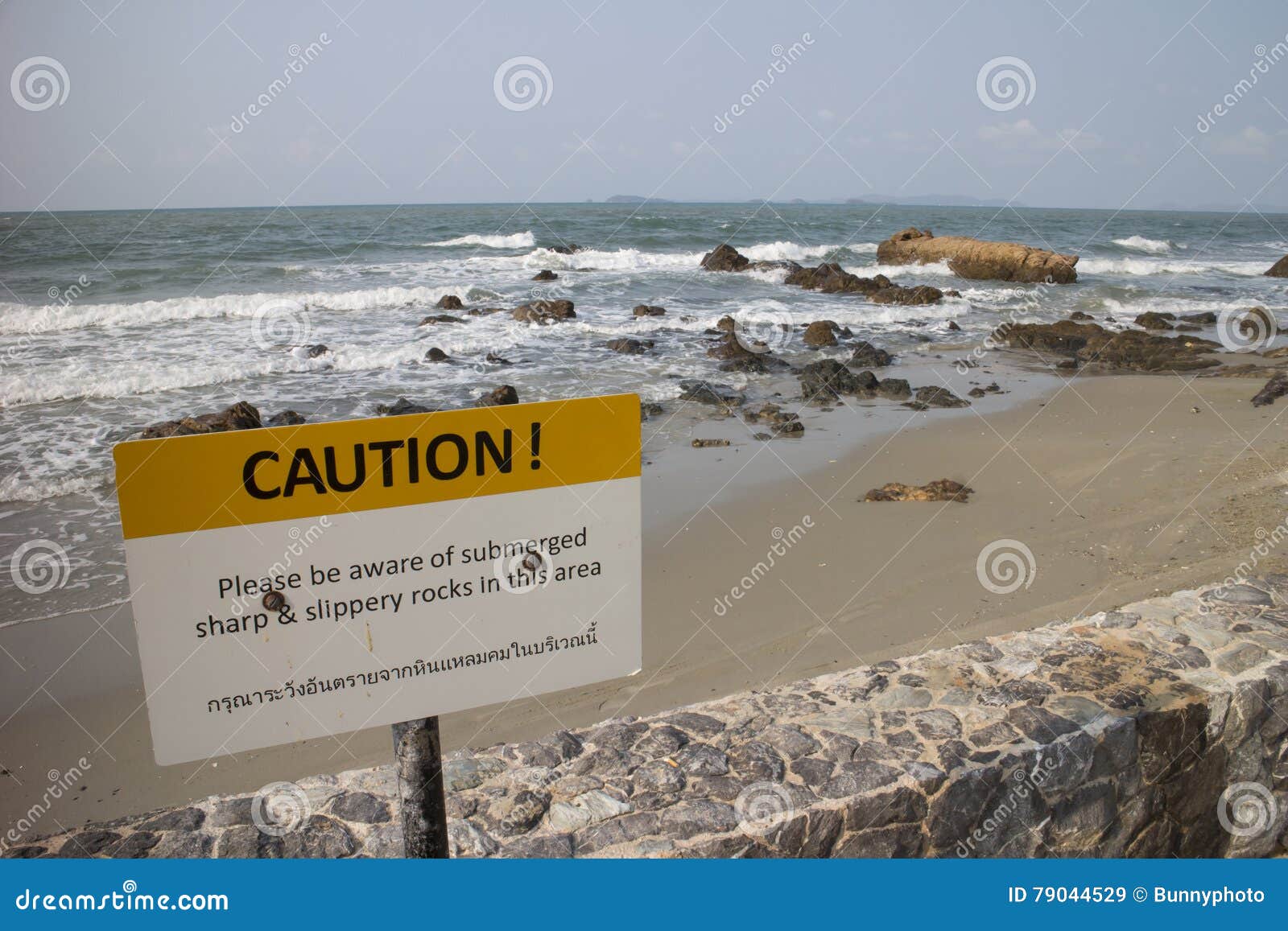 Warning Sign of Submerged Sharp and Slippery Rocks Stock Image - Image ...