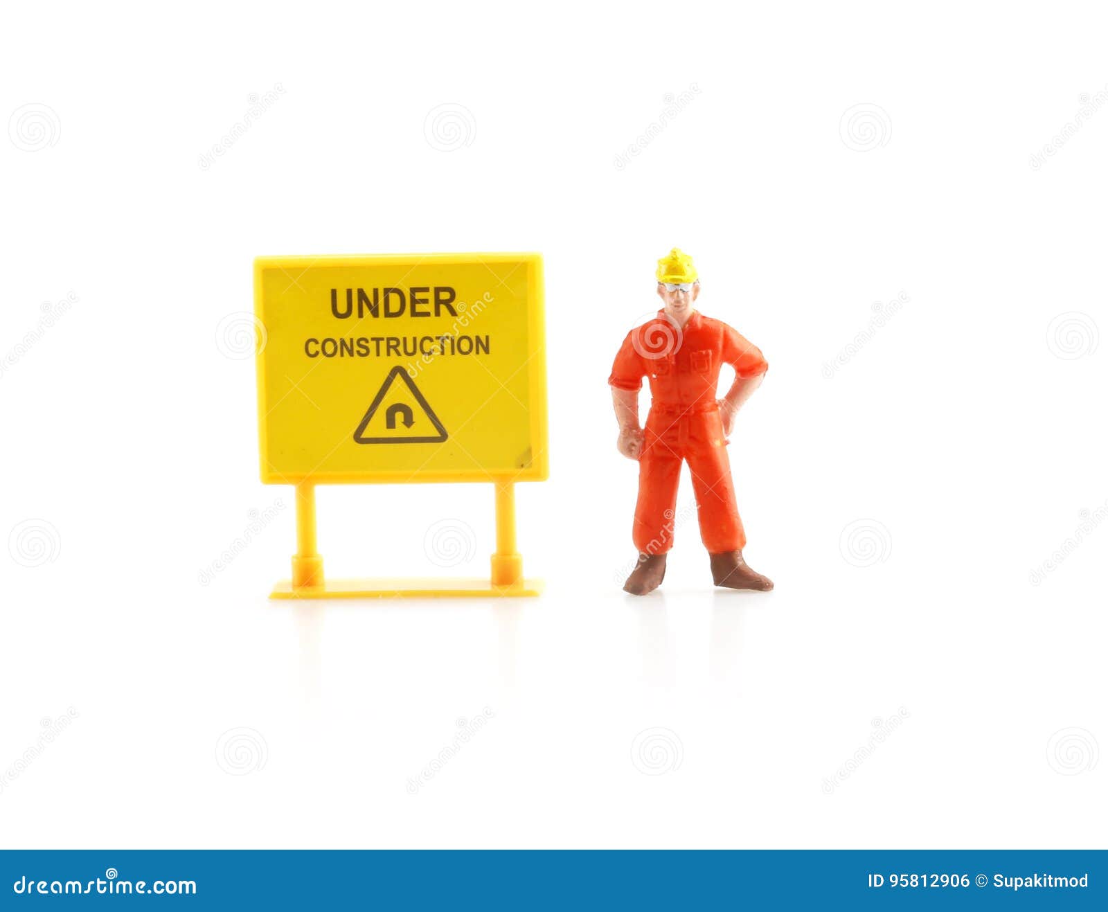 Warning Sign Under Construction with Miniature Figure Labo Stock Photo ...