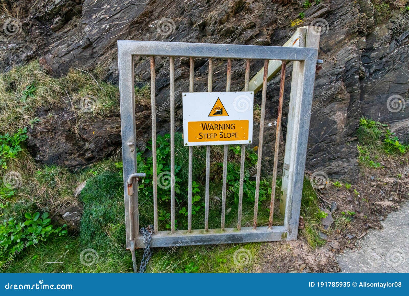 A Warning, Steep Slope Sign On A Metal Gate On The Coast Of Cornwall ...