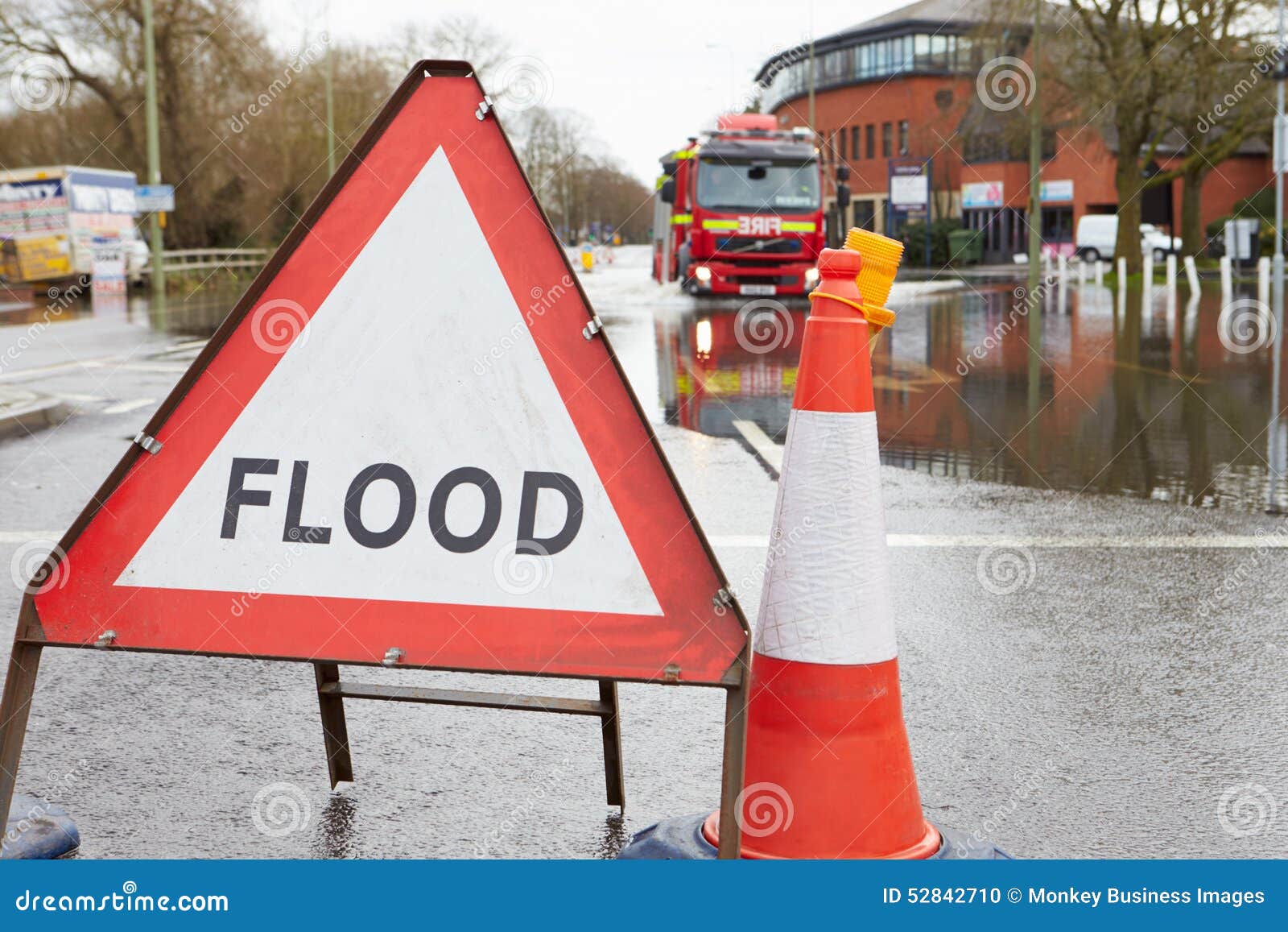 Warning Traffic Sign on Flooded Road with Fire Engine Stock Photo ...