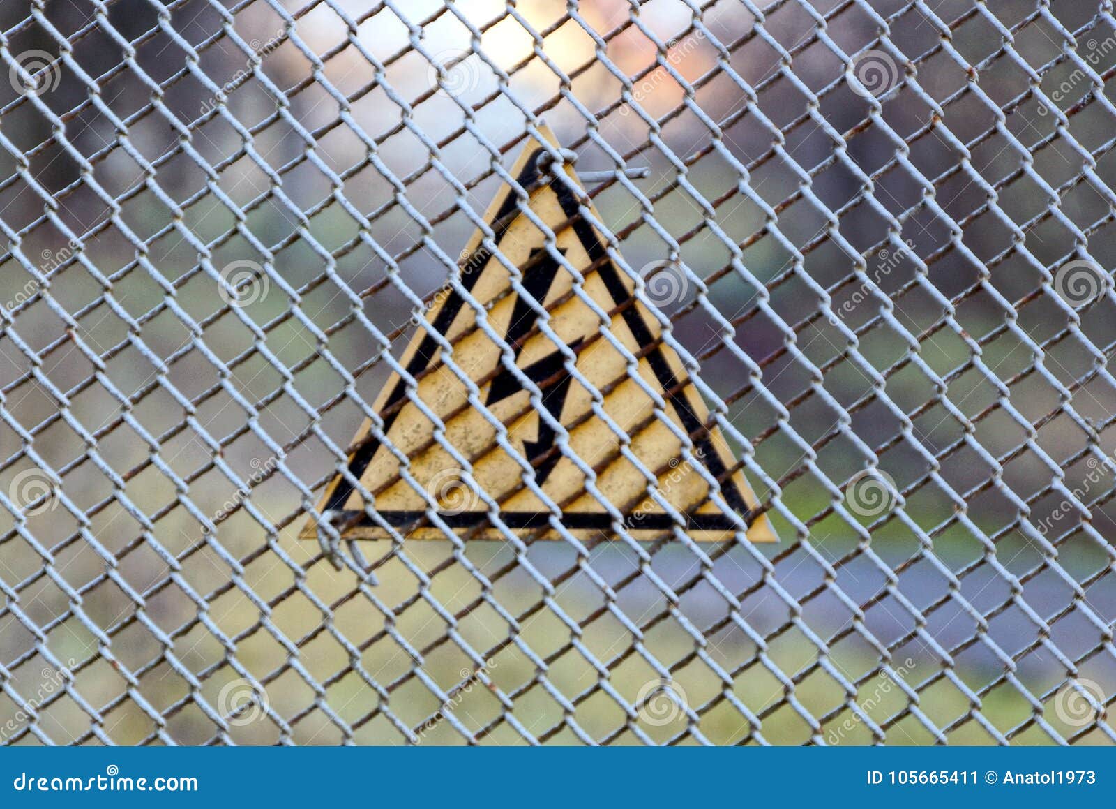 Warning Triangular Sign With Lightning Symbol On The Fence. Life ...