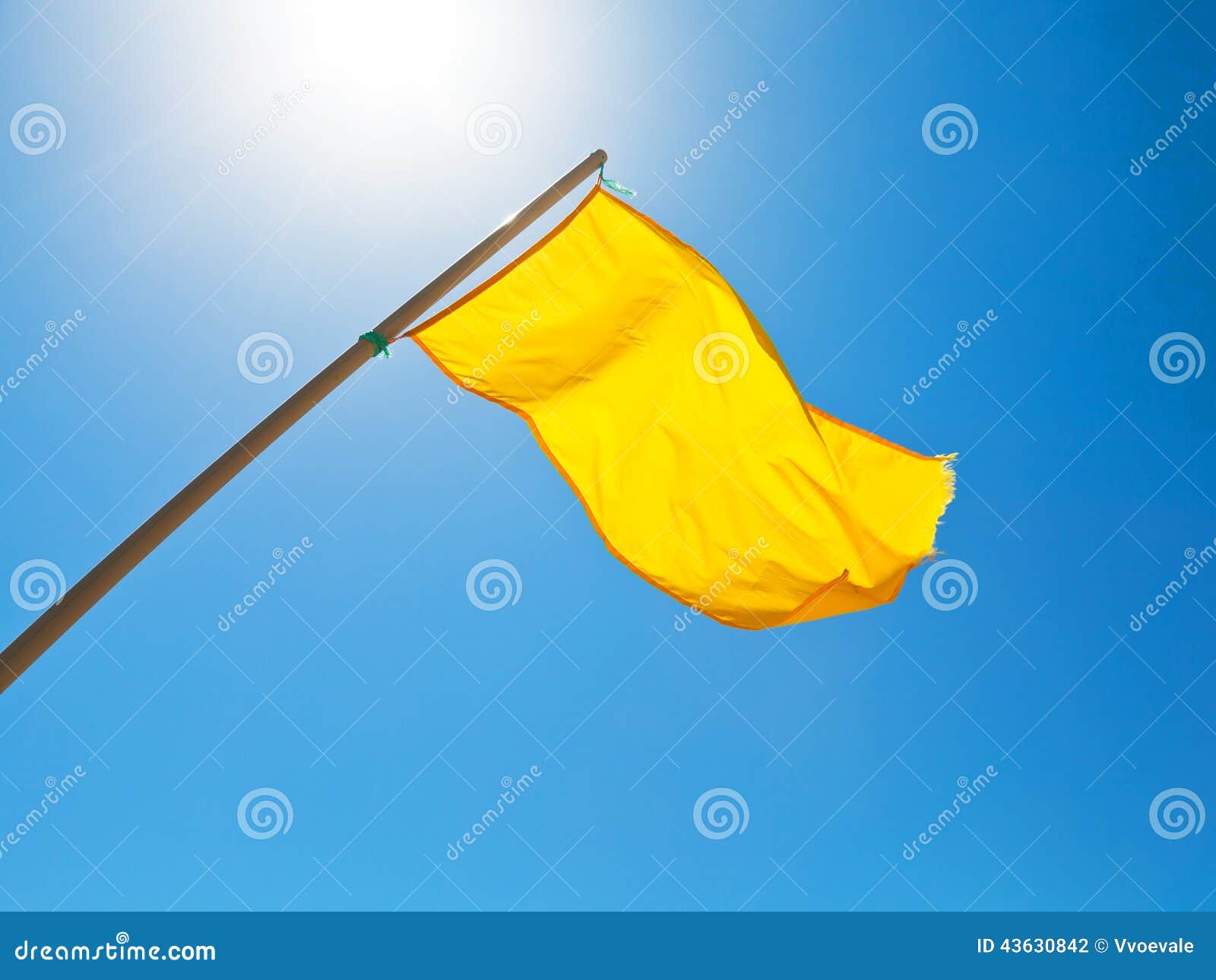 Warning Yellow Flag Under Sun with Blue Sky Stock Photo - Image of beam ...