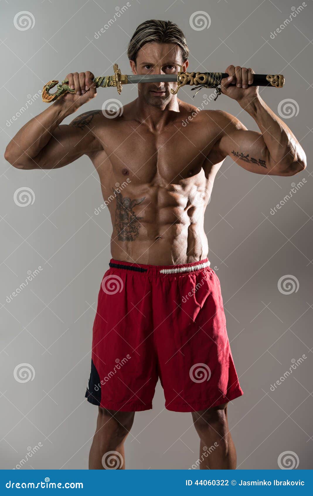 Warrior with Short Sword Over Grey Background Stock Photo - Image of ...