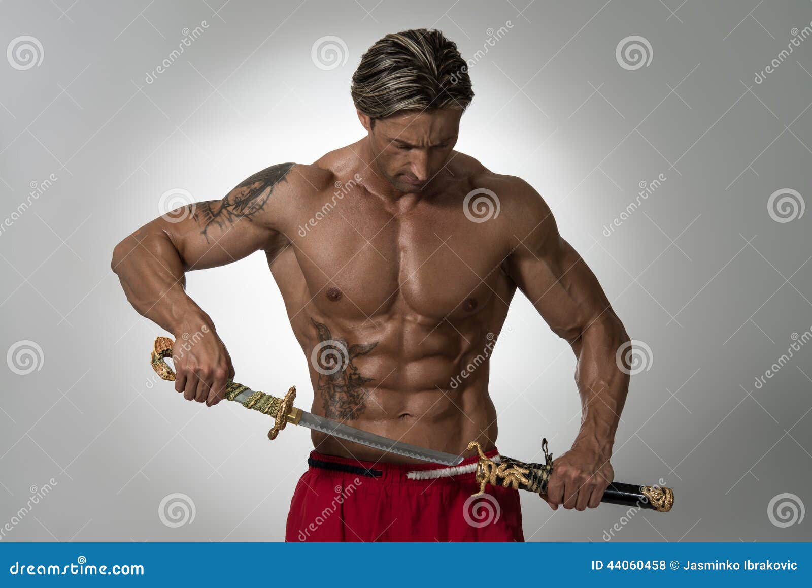 Warrior with Short Sword Over Grey Background Stock Photo - Image of ...