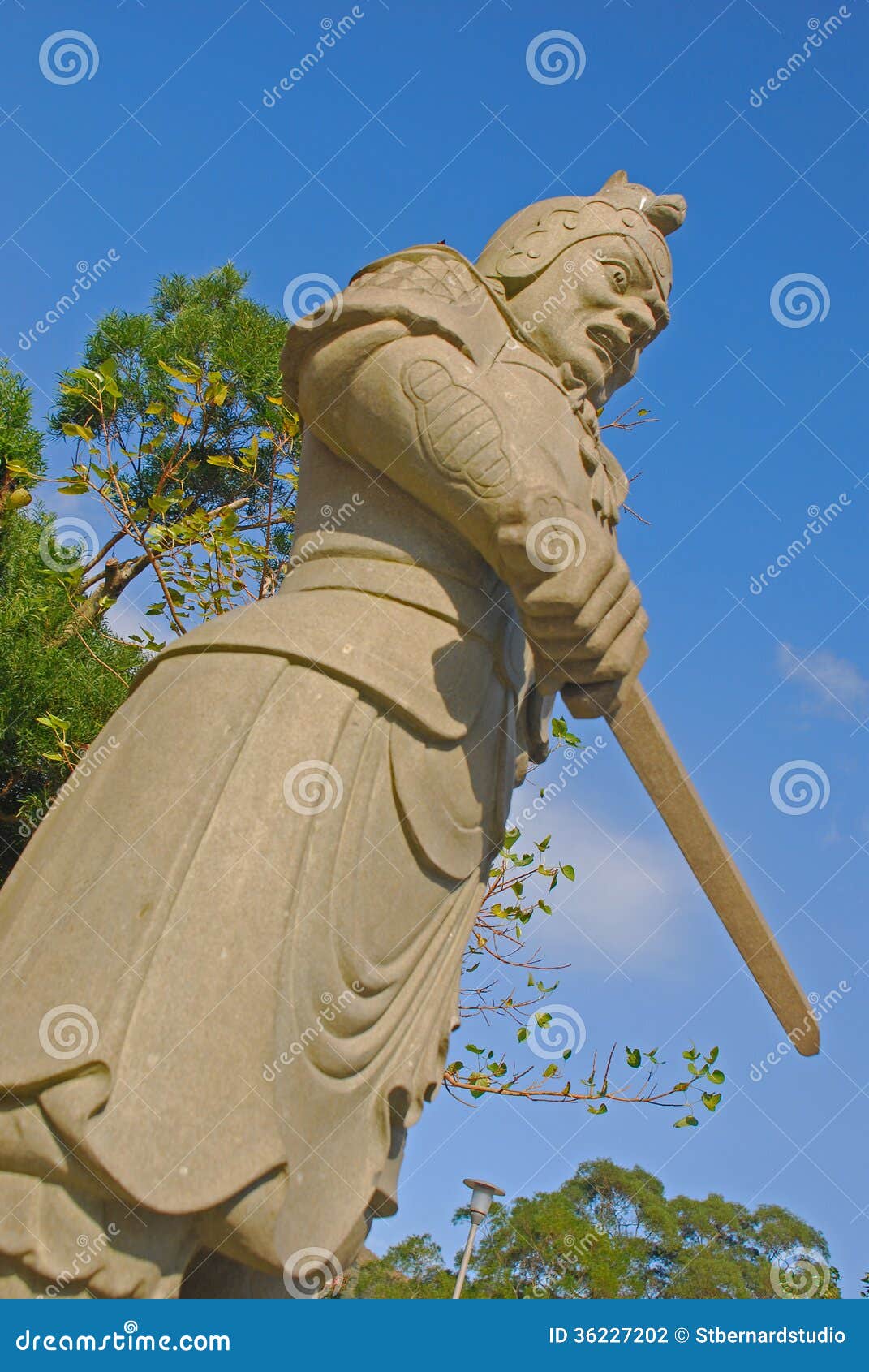 Warrior Statue Holding a Short Sword Stock Photo - Image of carving ...