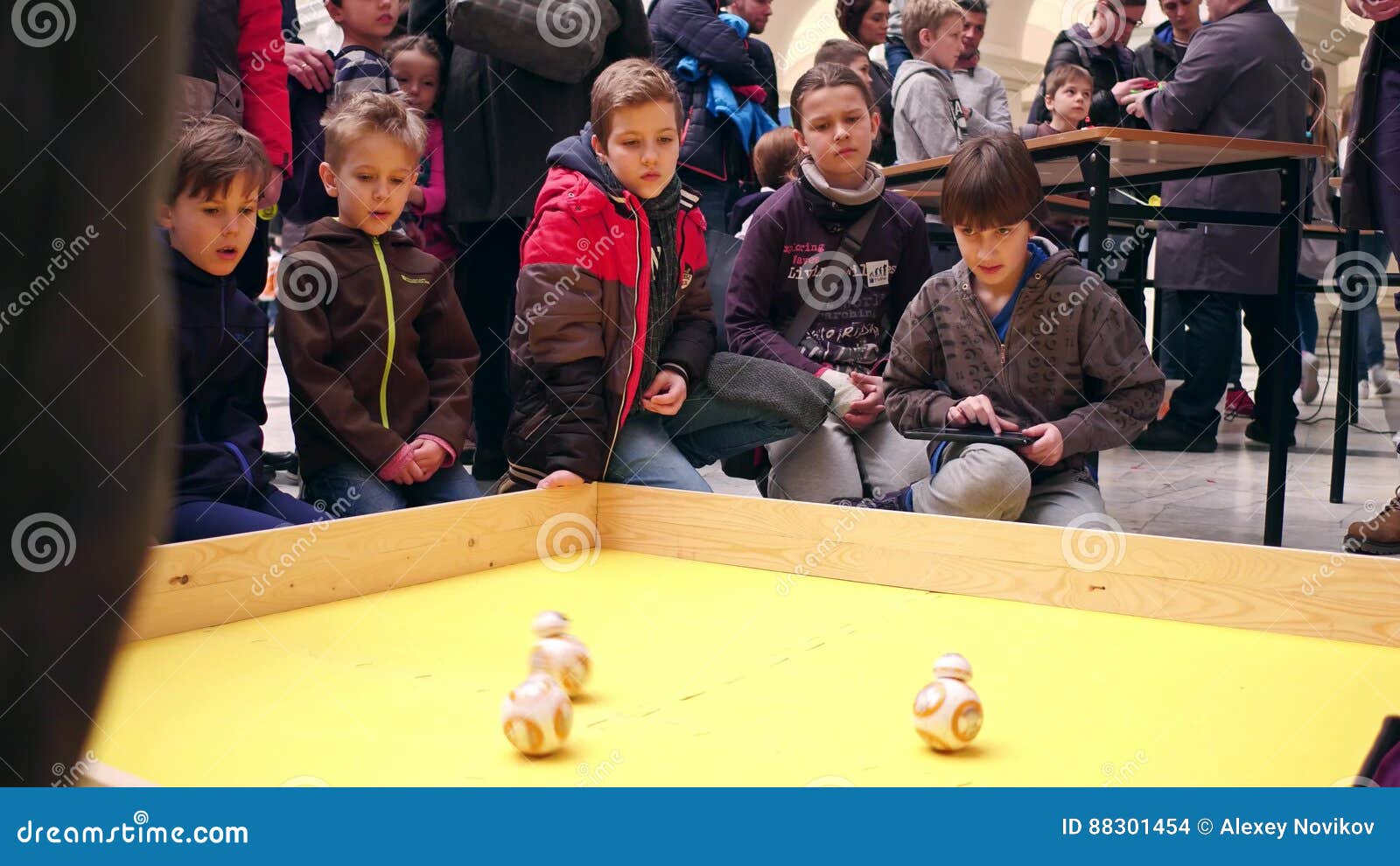 WARSAW, POLAND - MARCH, 4, 2017. Kids Operating Small Gyro Robots ...