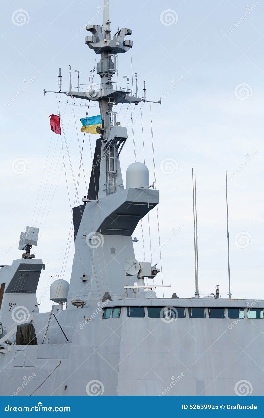Closeup Of A Mast And Antennas On A Warship Agains A Bright Blue Sky ...