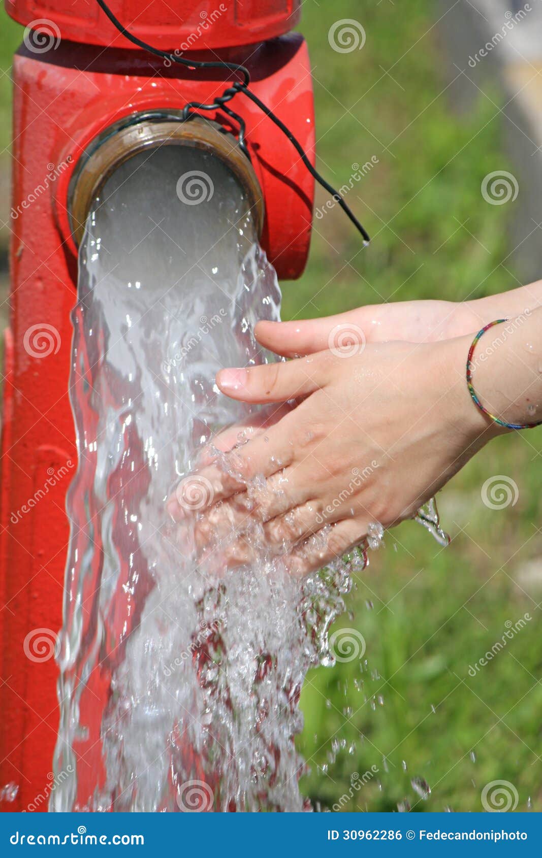 Wash Hands Under the Jet of Water from a Fire Hydrant Stock Photo ...