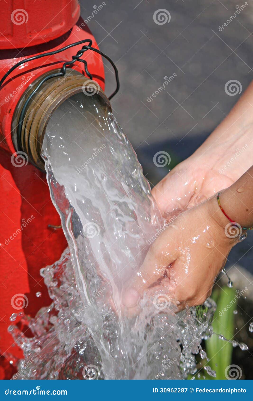 Wash Hands Under the Jet of Water from a Fire Hydrant Stock Image ...