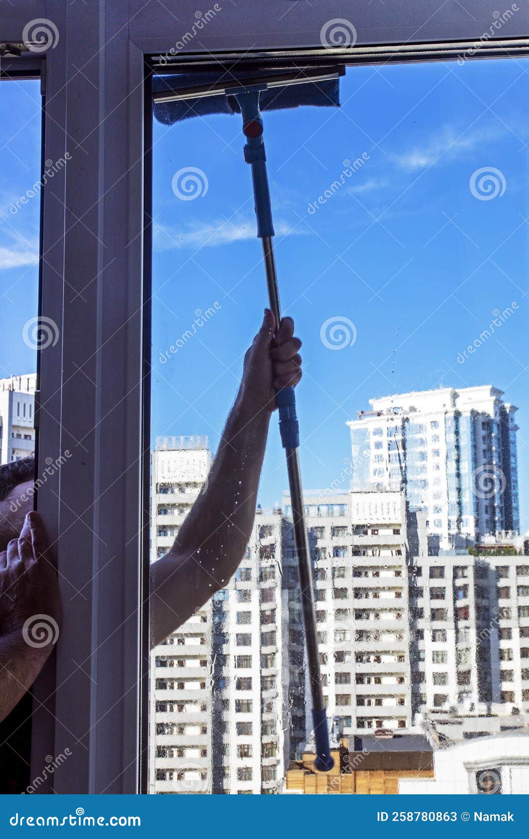 Wash Panoramic Windows Against the Blue Sky, Cleaning Company Stock ...