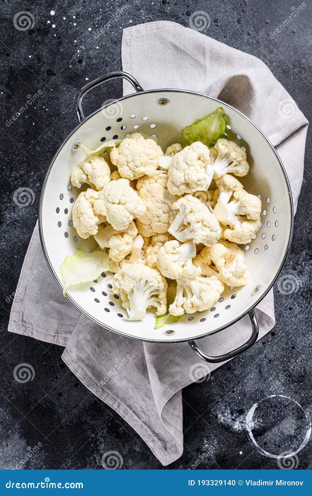 Washed Fresh Cauliflower Cut into Pieces in a Colander. Black ...