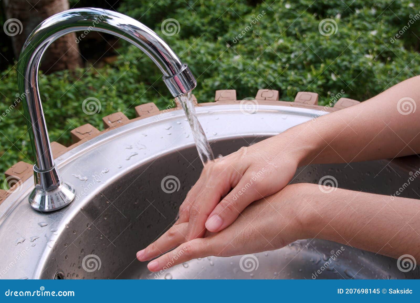 Washing Back Hand by Clean and Clear Water that Flows from the Tap at ...
