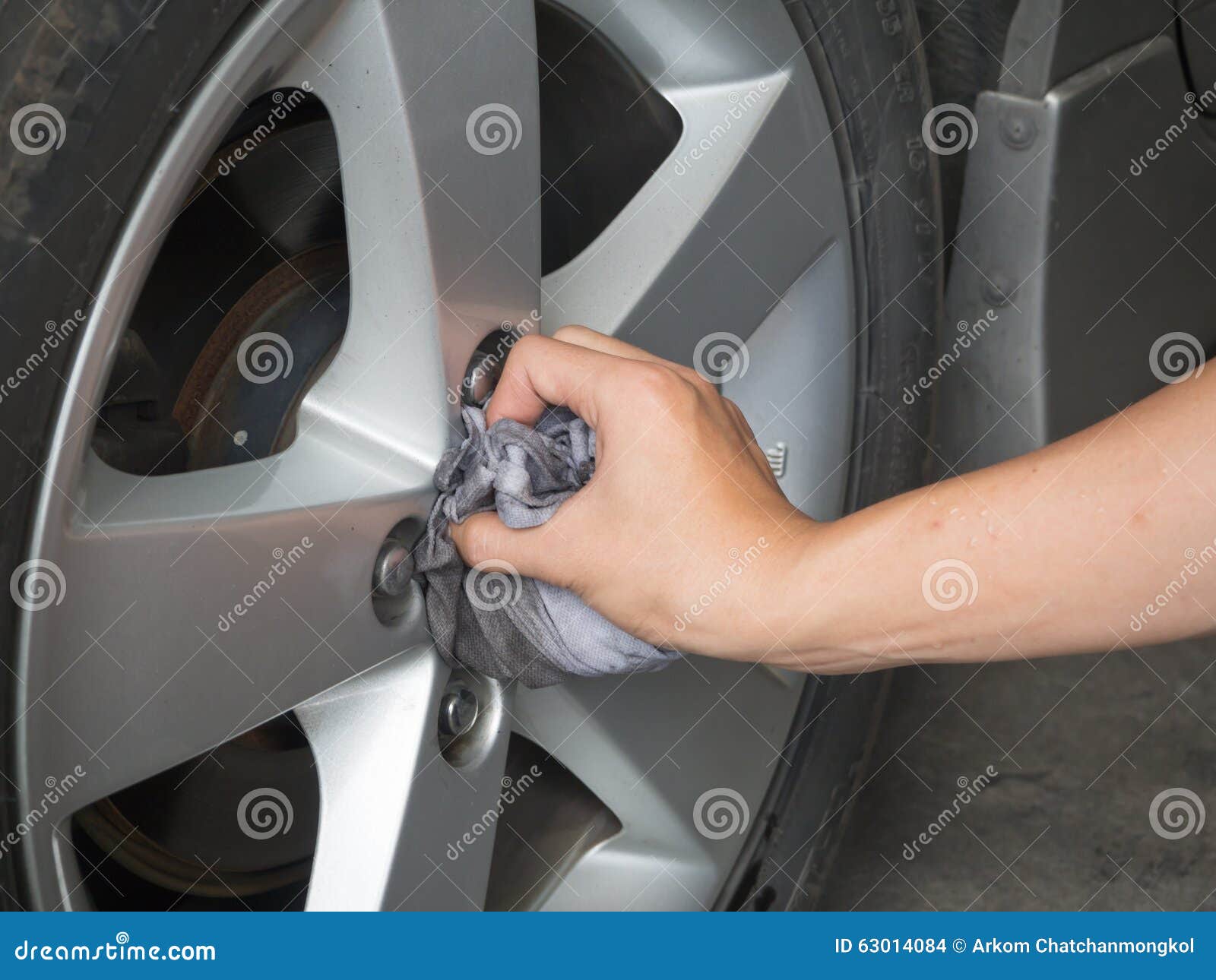 Washing car s alloy wheels stock photo. Image of service - 63014084