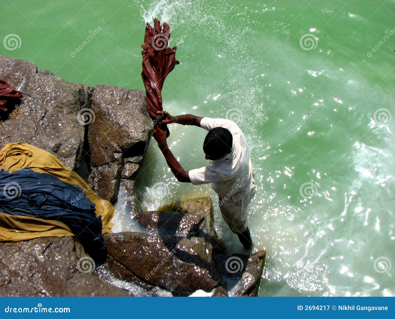 Washing Clothes stock image. Image of drip, males, poor - 2694217