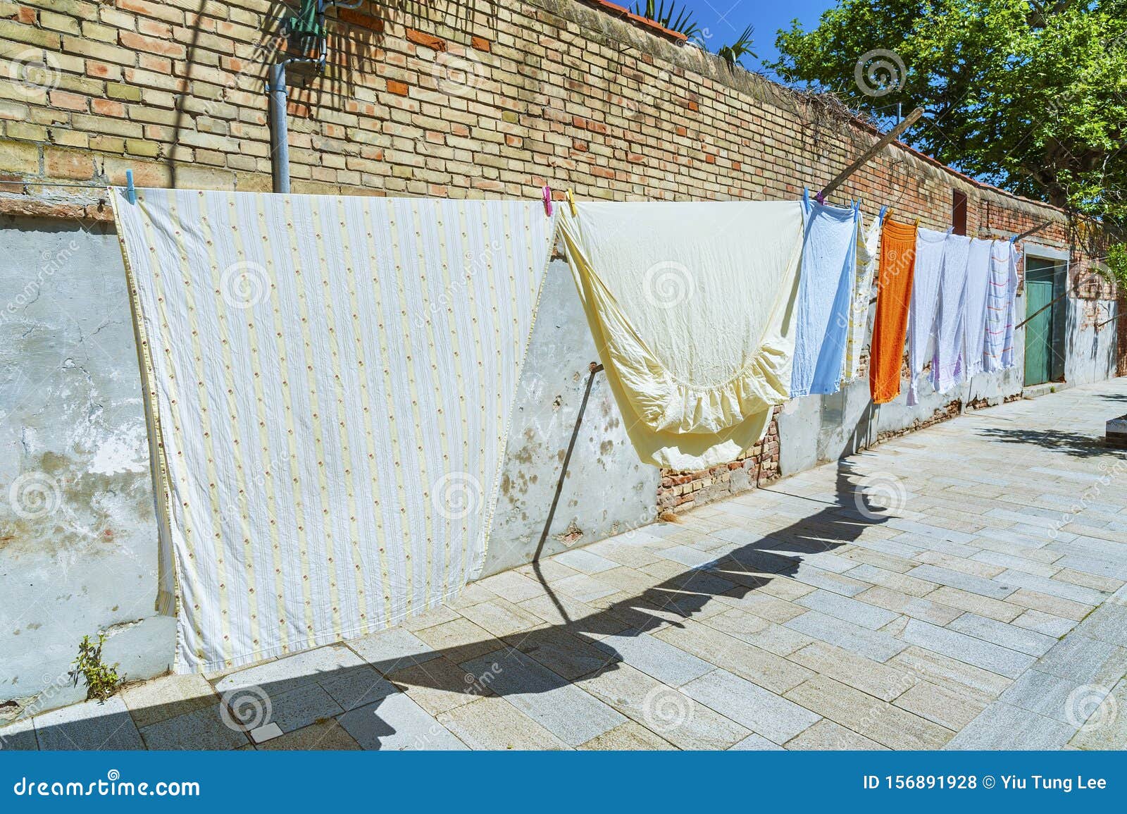 Laundry line stock photo. Image of alley, summertime - 156891928