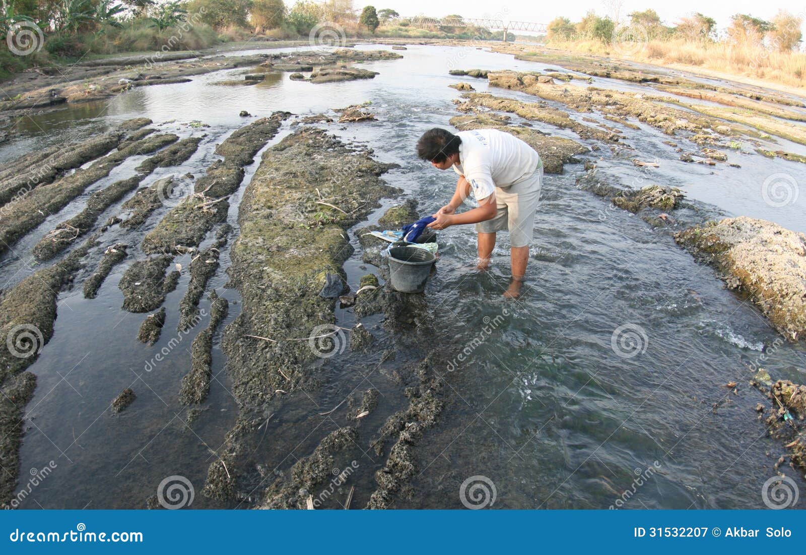 Washing in drying river editorial photography. Image of sari - 31532207
