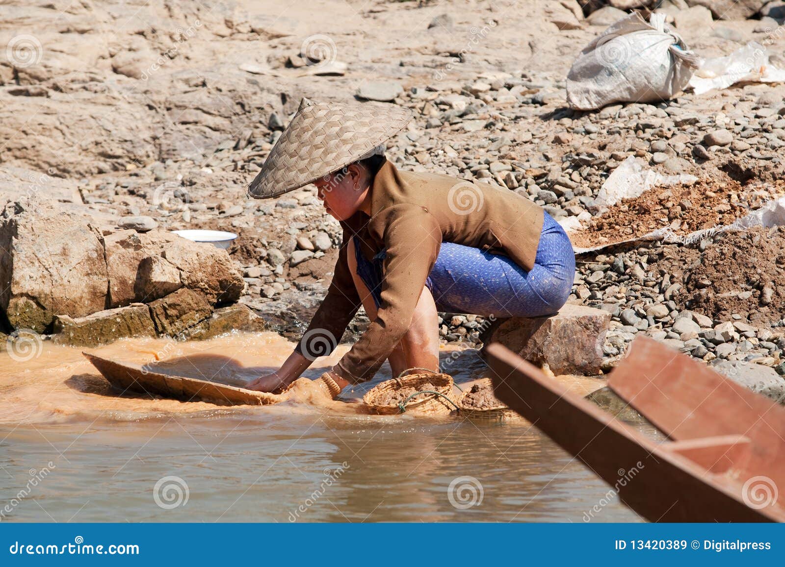 Washing gold in the river stock image. Image of woman - 13420389