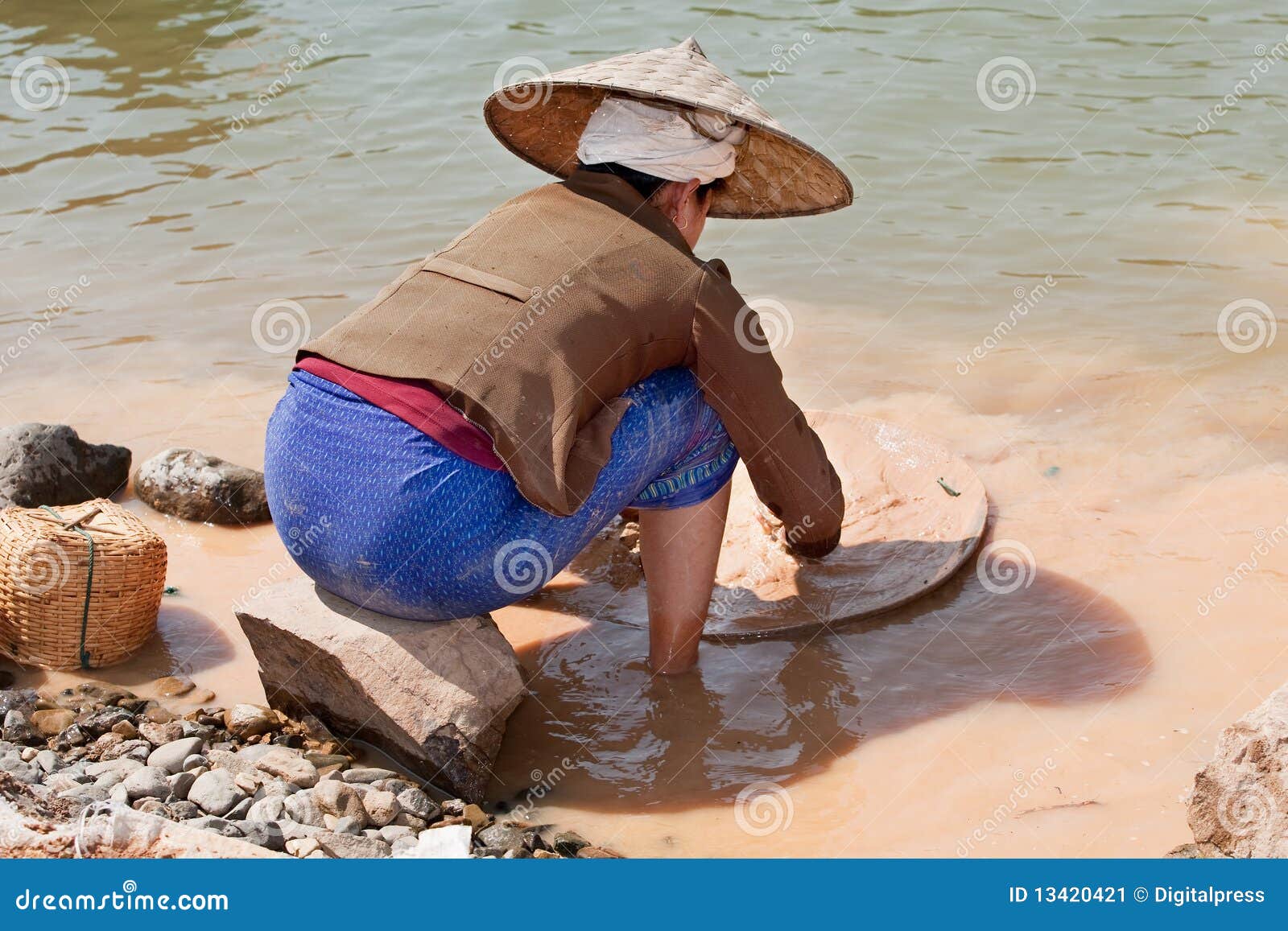 Washing gold in the river stock image. Image of production - 13420421